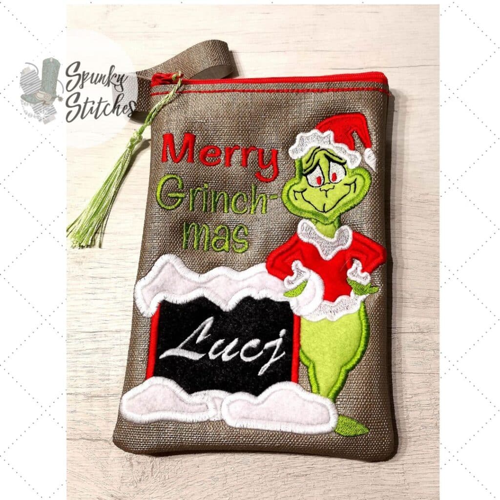 Grinch holding Christmas Ball Zipper Bag